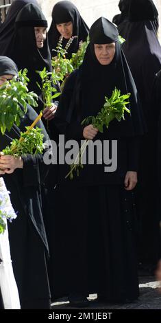 Greek Orthodox nuns walking in a procession from the Tomb off the ...