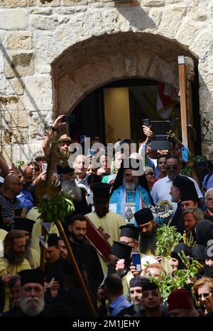 Greek Orthodox priests and nuns walking in a procession from the Tomb ...