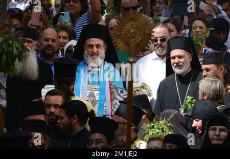 Greek Orthodox priests and nuns walking in a procession from the Tomb ...