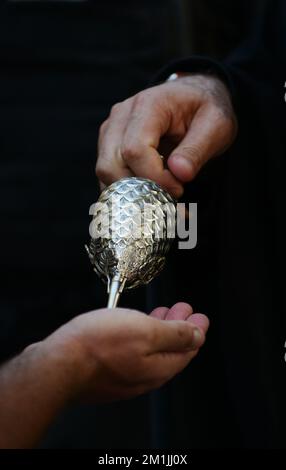A Greek Orthodox priest Anointing Holy Oil from a traditional Silver ...