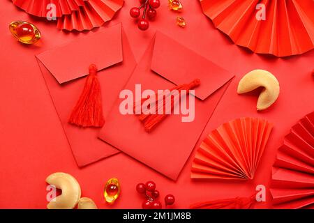 Fortune cookies with red envelopes and Chinese symbols on grunge ...