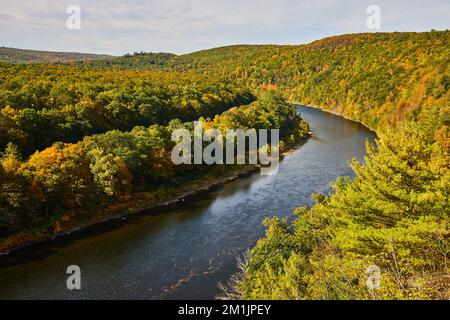 country forest river in early spring with no vegetation on the shores ...