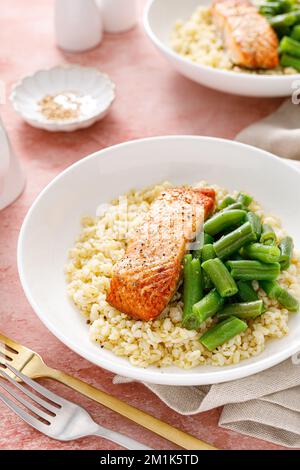 Salmon fillet grilled with bulgur and green beans. Healthy food, diet ...
