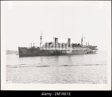 USS Wakefield (AP-21), Former Ocean Liner SS Manhattan, Being Towed to ...