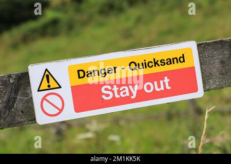 Danger quicksand warning sign Stock Photo - Alamy