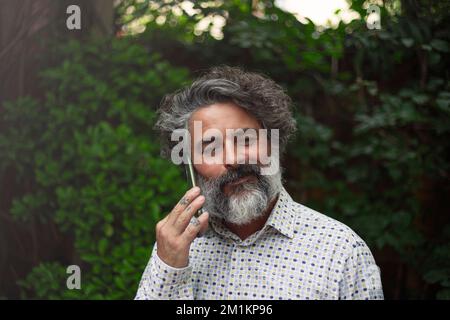 A shallow focus shot of a Hipster businessman talking with a worried ...