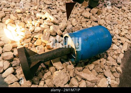 An unexploded mortar mine lying on the rocks. Clearance of unexploded ...