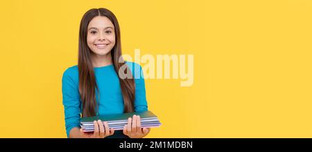 cheerful child girl hold notepad for homework and dog toy, childhood ...