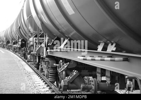 A closeup grayscale of a tank wagons train on the railway track Stock ...