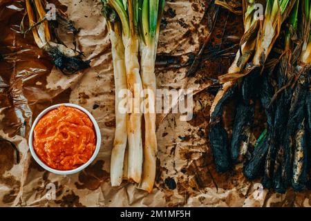 high angle view of some roasted calcots, sweet onions typical of ...