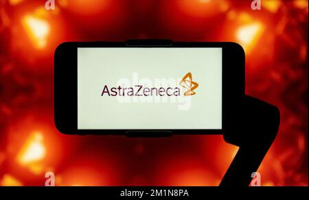 In this photo illustration, the logo of AstraZeneca is seen displayed ...