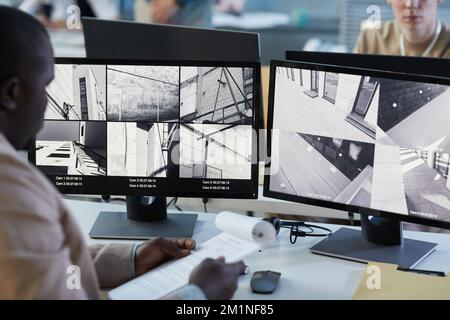Background image of computer screens with surveillance camera footage ...