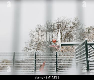 Views of snow on the outdoor basketball court in Clissold Park, Hackney ...