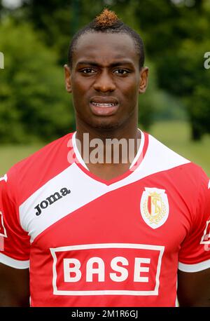 Standard's Paul-Jose Mpoku M'Poku Ebunge signs an autograph after a ...