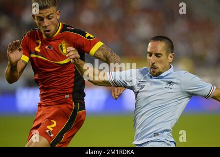 Belgium's Toby Alderweireld and French Franck Ribery fight for the ball ...