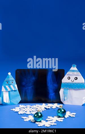 Christmas radiology - X-rays, snowmen and snowflakes on a blue ...