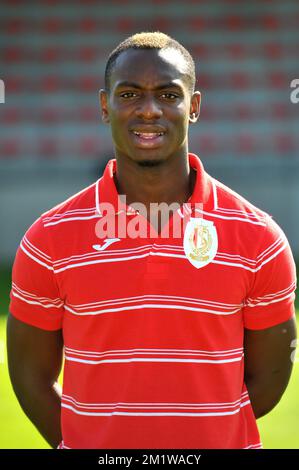 Standard's Paul-Jose Mpoku M'Poku Ebunge signs an autograph after a ...