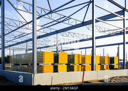 Assembled steel frame and stacks of sandwich panels for the facade of a ...