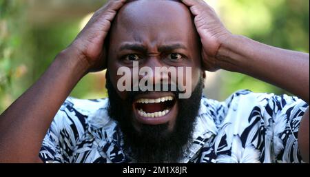 African man reacting with SHOCK and TERROR. Surprised emotion, unbelief ...