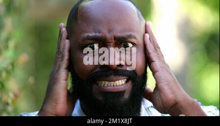 African man reacting with SHOCK and TERROR. Surprised emotion, unbelief ...