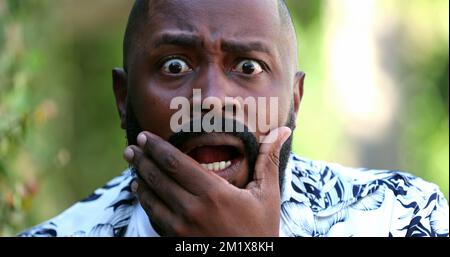 African man reacting with SHOCK and TERROR. Surprised emotion, unbelief ...