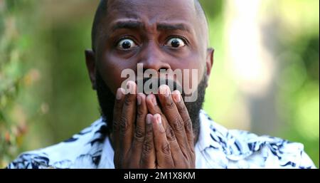 African man reacting with SHOCK and TERROR. Surprised emotion, unbelief ...