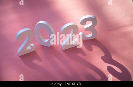 A number 7 on a pink wooden block isolated on blue background Stock ...
