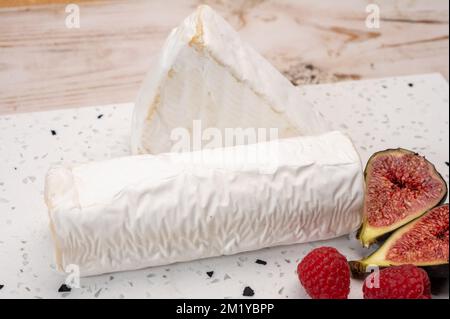 French organic matured white goat cheese with white mold close up ...