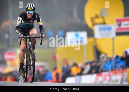 Belgian Ellen Van Loy crosses the finish line at the women's elite race ...