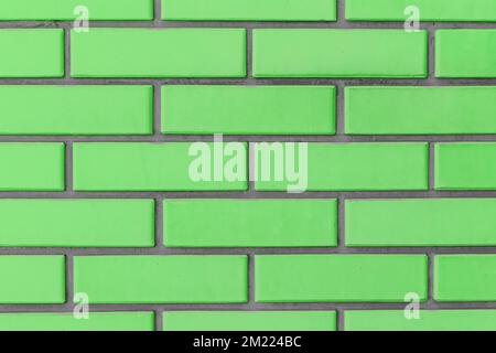 Green verdant light salad color paint on concrete surface stone wall ...