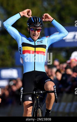 Belgian Quinten Hermans celebrates as he crosses the finish line to win ...