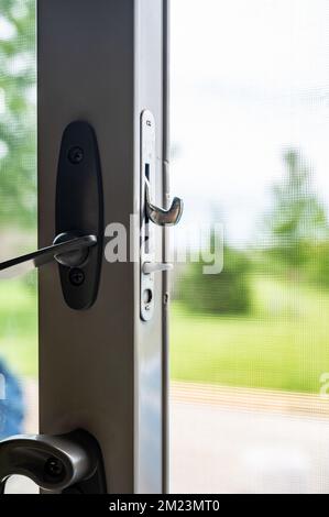 Handle, locking hardware, and jam to a sliding glass and screen door ...