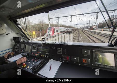 Illustration shows a driver in a train at the launching by Infrabel ...