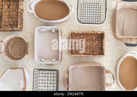 Flat lay of storage boxes; containers and baskets with different sizes ...