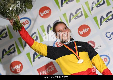 Belgian Tess Van Loy celebrates as she crosses the finish line at the ...