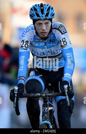 Belgian Michael Vanthourenhout crosses the finish line at the men elite ...
