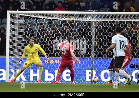 Belgium's goalkeeper Simon Mignolet and Russia's Viktor Vasin fight for ...