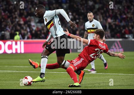 Belgium's Christian Benteke and Russia's Roman Neustadter fight for the ...