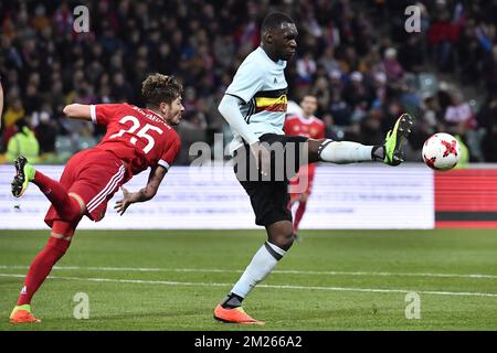 Belgium's Christian Benteke and Russia's Roman Neustadter fight for the ...