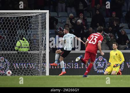 Belgium's goalkeeper Simon Mignolet and Russia's Viktor Vasin fight for ...