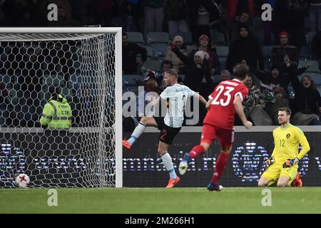 Belgium's goalkeeper Simon Mignolet and Russia's Viktor Vasin fight for ...