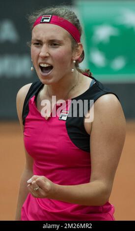 Elise Mertens, of Belgium, celebrates after defeating Naomi Osaka, of ...