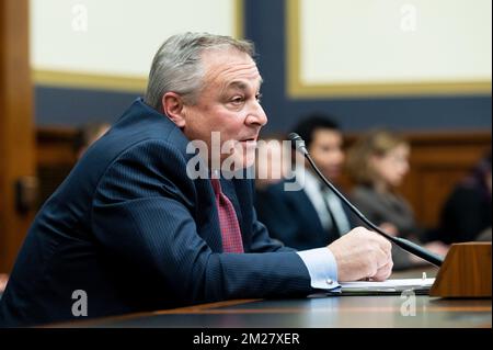 FTX Group Chief Executive Officer John J. Ray III, right, takes his ...