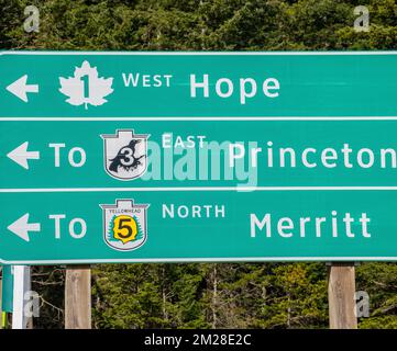A British road junction sign with directions to local destinations for ...