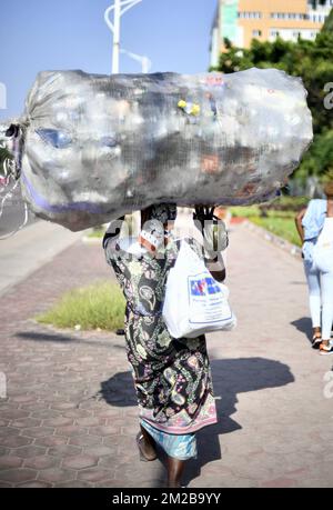 Illustration picture shows a woman carrying a watermelon in Kigali ...