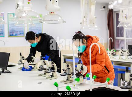 HOHHOT, CHINA - DECEMBER 14, 2022 - Staff disinfect a classroom at the ...