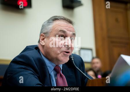 FTX Group Chief Executive Officer John J. Ray III, right, takes his ...
