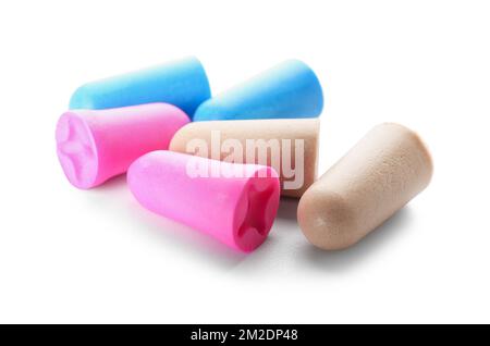 Different ear plugs on color background Stock Photo - Alamy