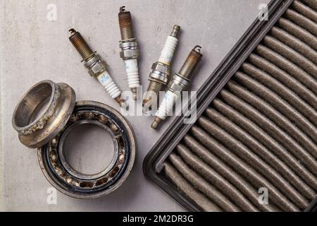 Three kinds of used car spare parts that must be replaced Stock Photo ...
