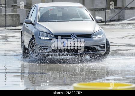 Defensive driving training in heavy rain or frozen roads conditions ...